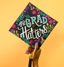 Students Decorate their UCF Graduation Caps for a Good Cause